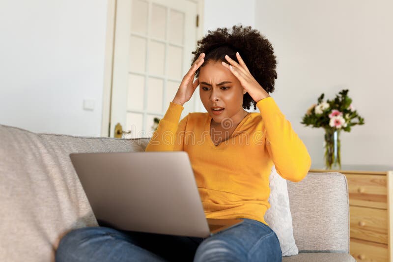 Unhappy Black Lady Using Laptop Having Problem Sitting at Home Stock ...