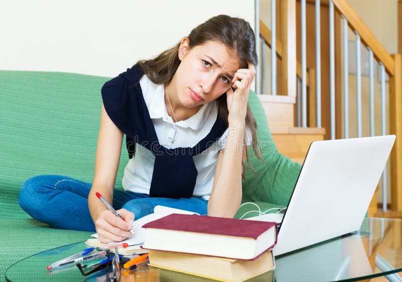 Unhappy girl study at home stock image. Image of casual - 81918495