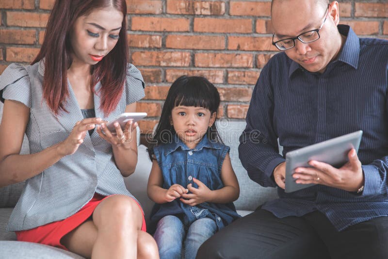 Busy Parenting Using Gadget Stock Photo - Image of beautiful, handphone ...