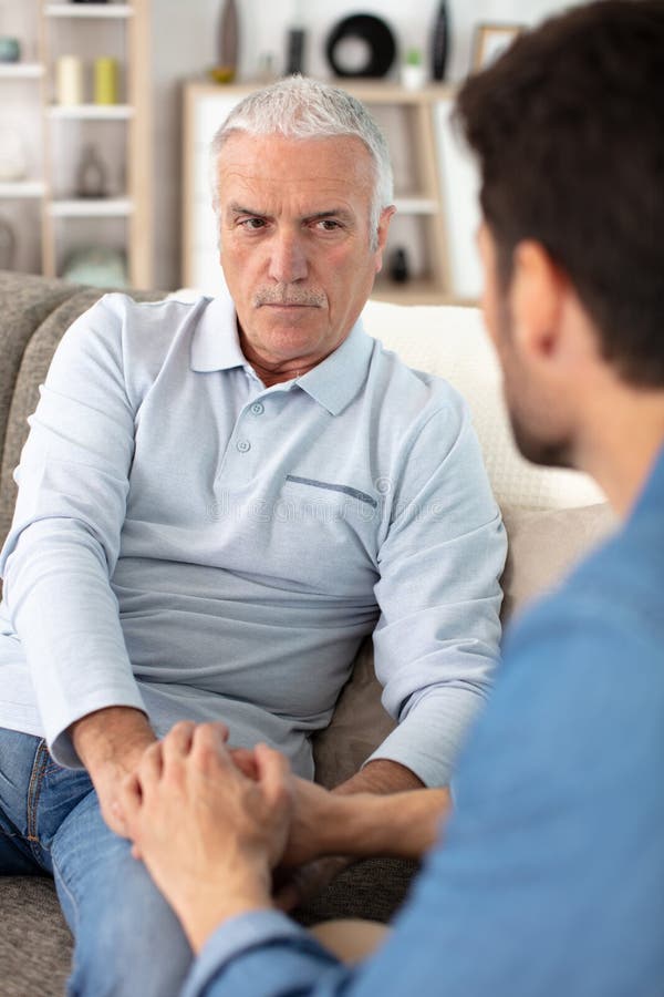 Unhappy old father and son stock photo. Image of adult - 241701966