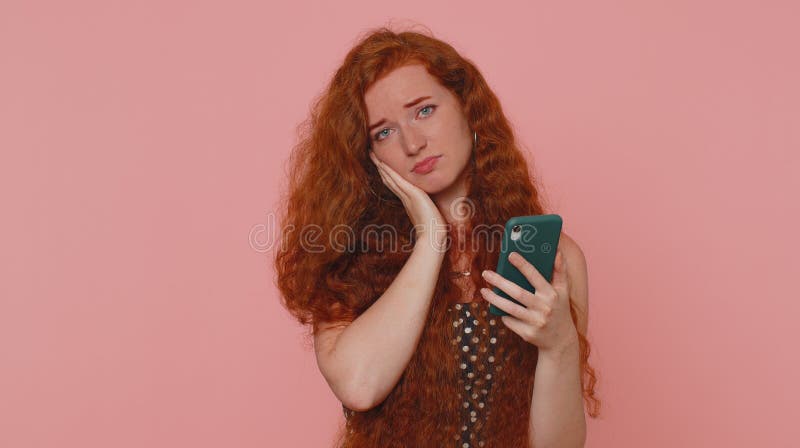 Unhappy Redhead Woman Use Smartphone Surprised By Lottery Results Bad