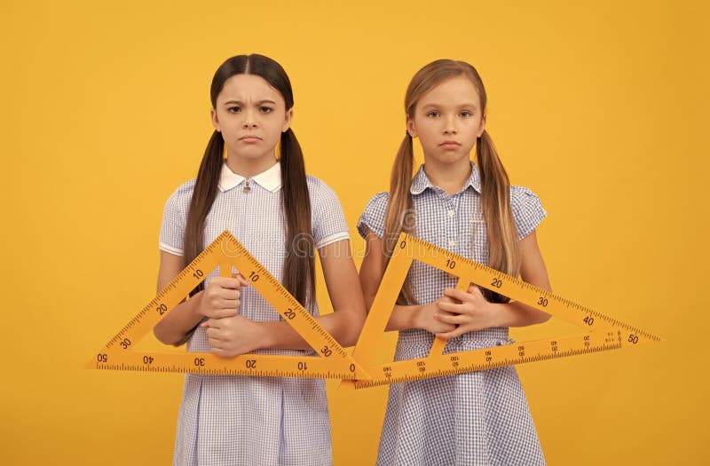 Unhappy School Age Children Hold Triangular Rulers for Geometry Lesson ...