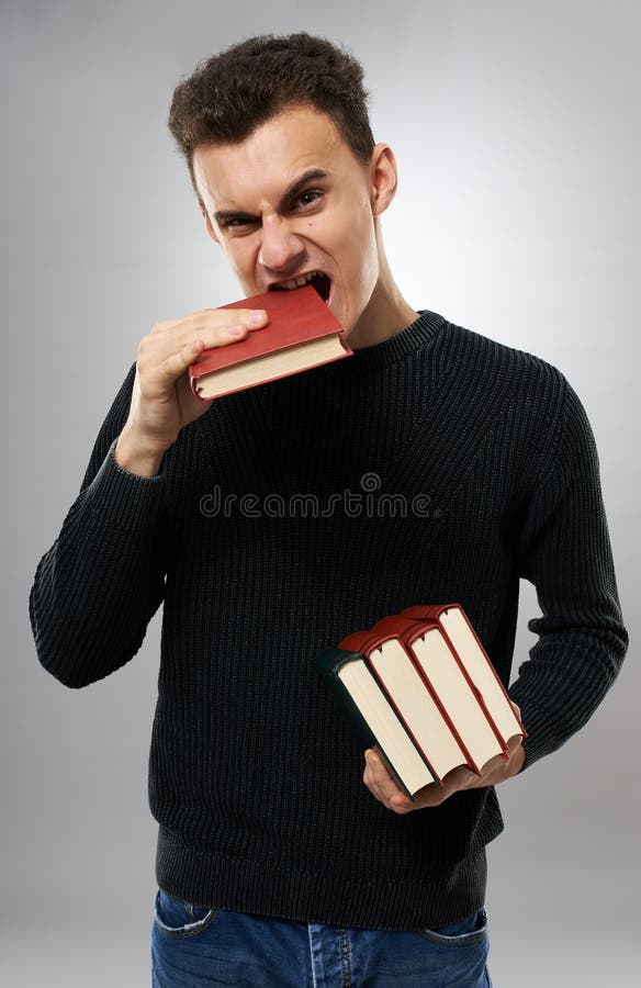 Unhappy Student with a Stack of Books Stock Image - Image of ...