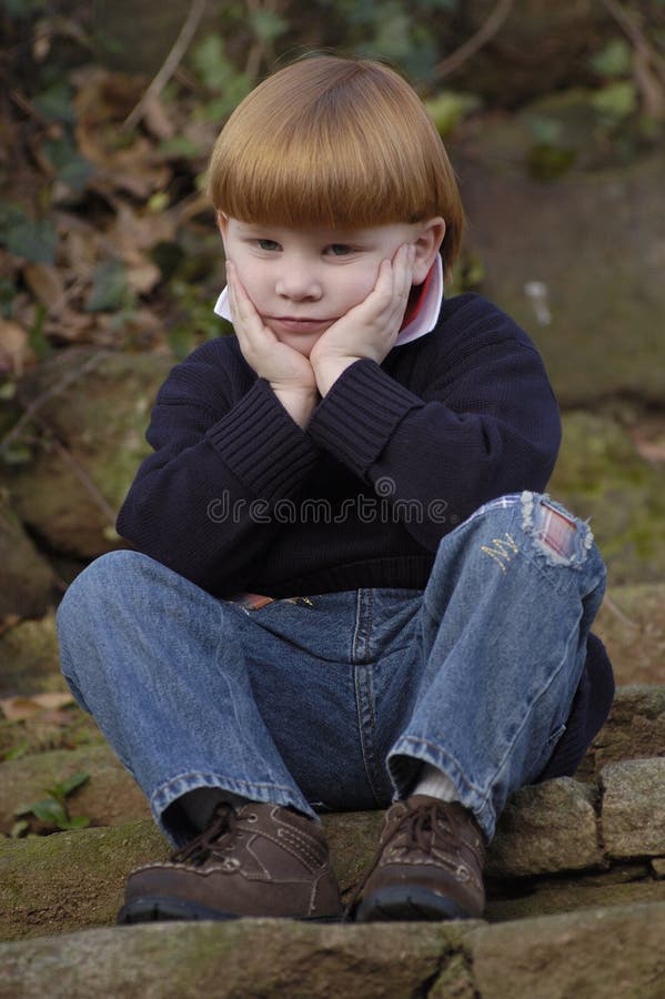 Unhappy young boy stock image. Image of outdoors, child - 23159983