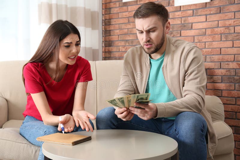Unhappy Young Couple with Money. Financial Problems Stock Photo - Image ...