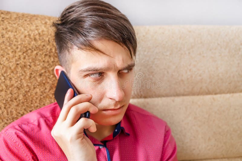 Unhappy Young Man with a Phone Stock Image - Image of human, home ...