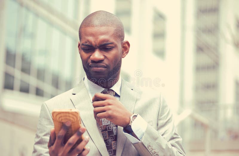 Unhappy Young Man Talking Texting on Cellphone Outdoors Stock Photo ...