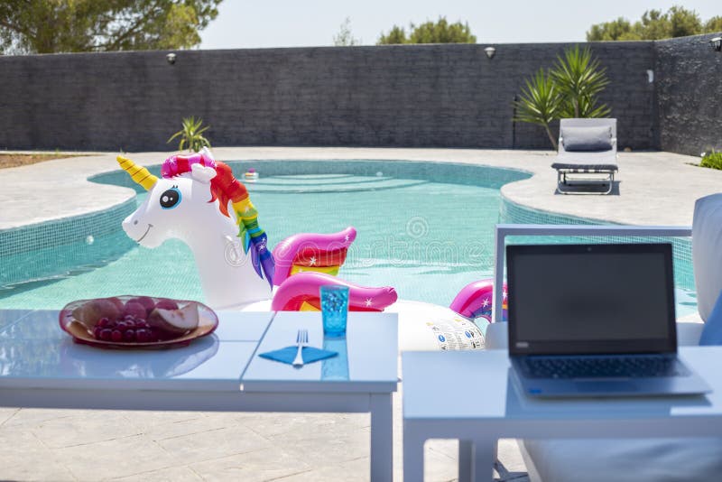 Unicorn Float in the Pool, Pool Office, Work or Swimming Stock Photo ...