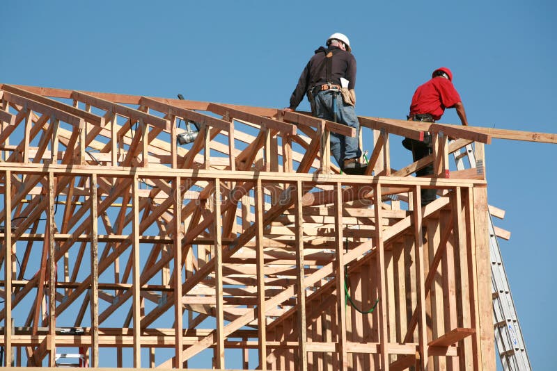 Unidentifiable Construction Workers Work on Framing a Building ...