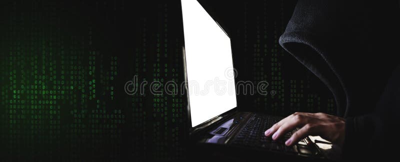 Unidentified Hacker in Black Hood Using Laptop Computer, on Black ...