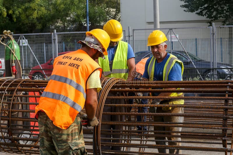 Unidentified Workers Working with Concrete Iron at a Construction Site ...
