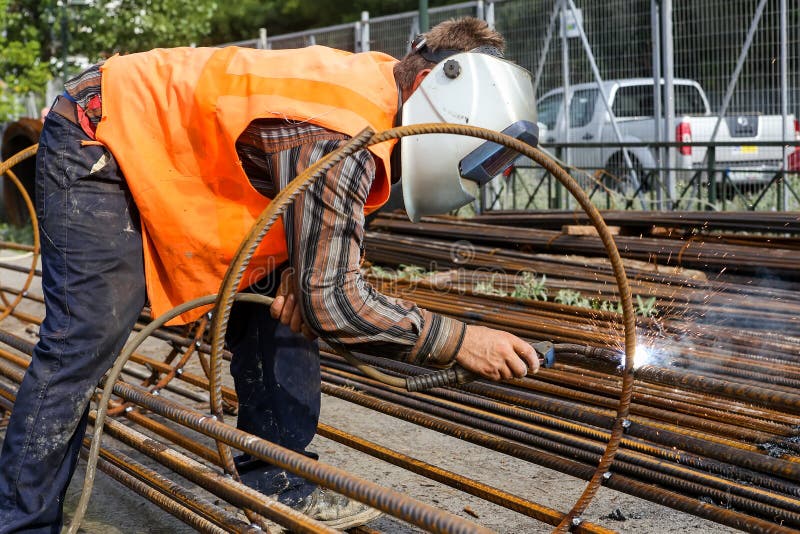 Unidentified Workers Working with Concrete Iron at a Construction Site ...