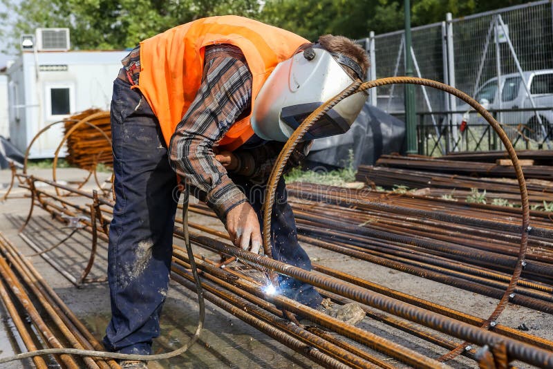 Unidentified Workers Working with Concrete Iron at a Construction Site ...