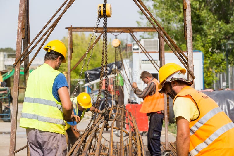 Unidentified Workers Working with Concrete Iron at a Construction Site ...
