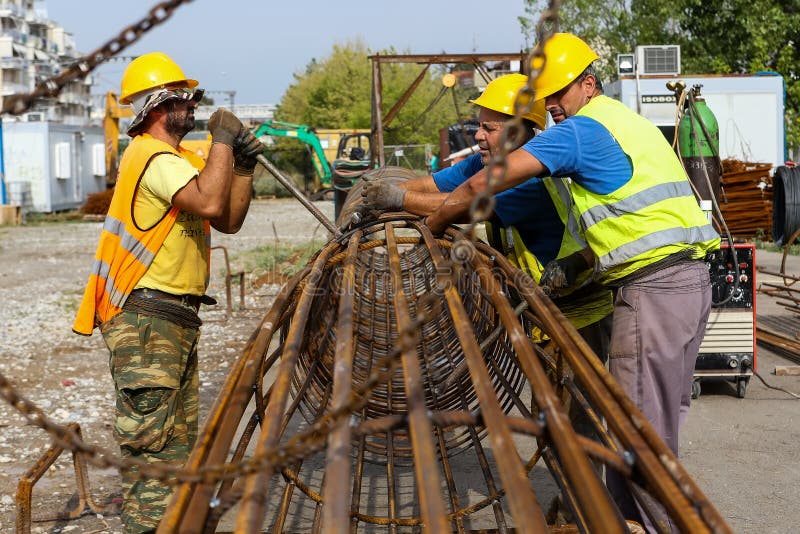 Unidentified Workers Working with Concrete Iron at a Construction Site ...