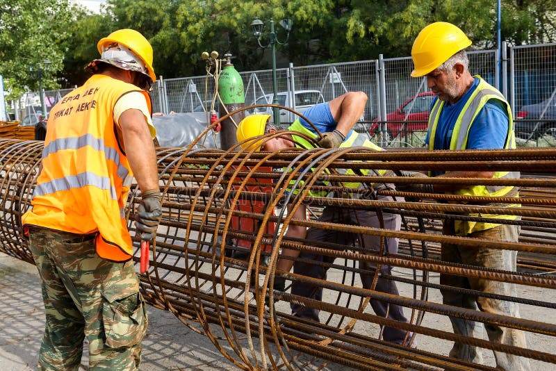 Unidentified Workers Working with Concrete Iron at a Construction Site ...