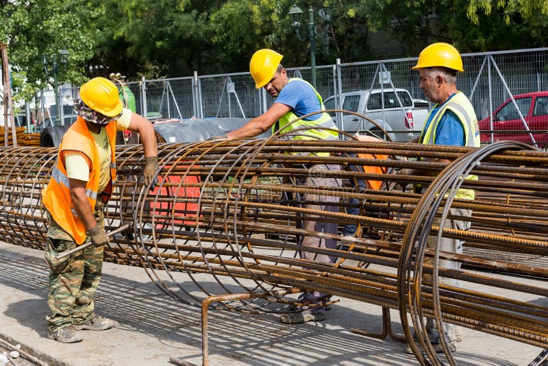 Unidentified Workers Working with Concrete Iron at a Construction Site ...