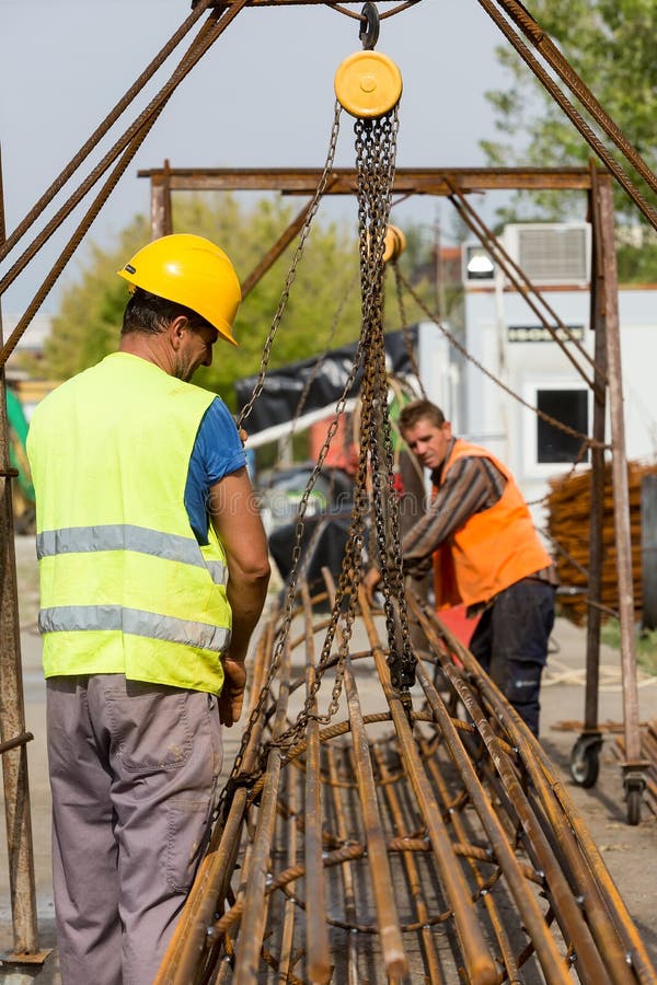 Unidentified Workers Working with Concrete Iron at a Construction Site ...