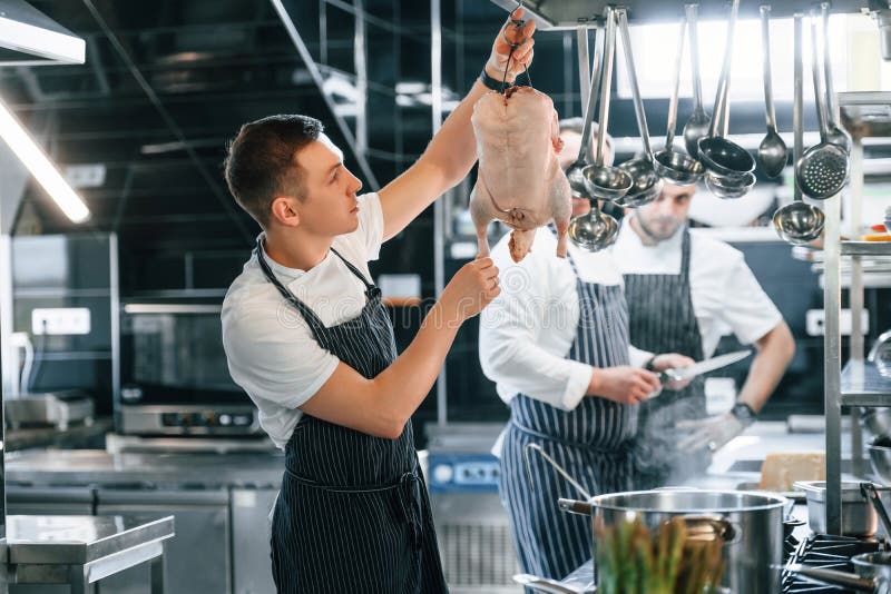 In Uniform. Kitchen Workers is Together Preparing the Food Stock Photo ...