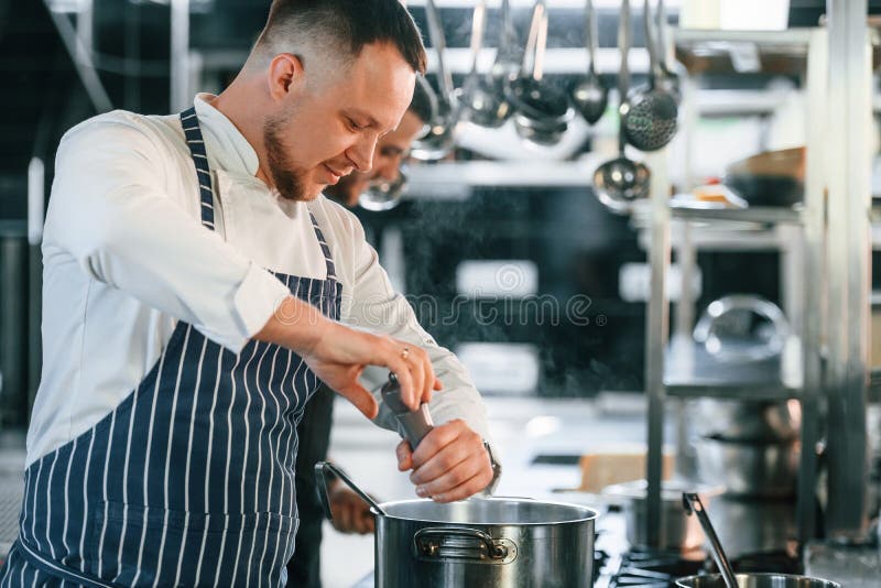 In Uniform. Kitchen Workers is Together Preparing the Food Stock Photo ...