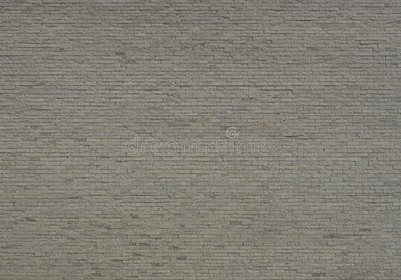 A Uniform Stone Wall Composed of Small, Rectangular Gray Bricks ...