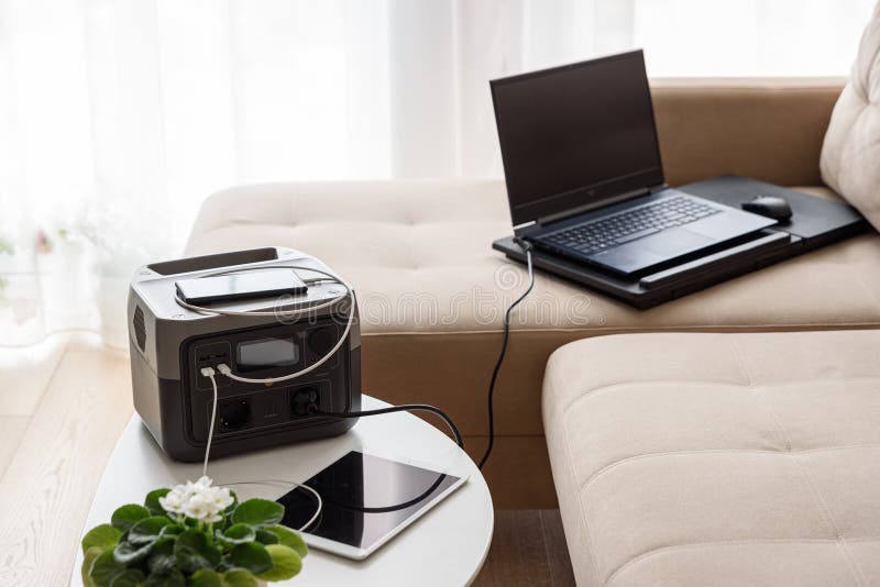 Uninterruptible Power Supply Source. Workspace on Sofa with Laptop ...