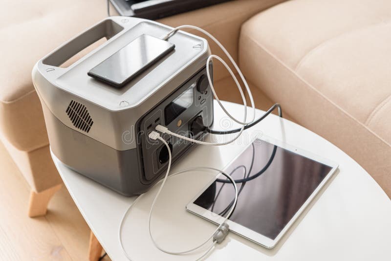 Uninterruptible Power Supply Source. Workspace on Sofa with Laptop ...