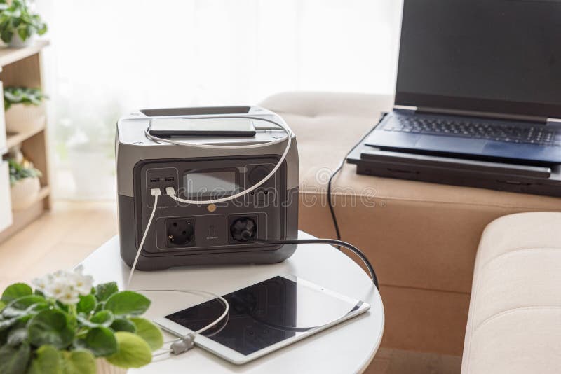 Uninterruptible Power Supply Source. Workspace on Sofa with Laptop ...