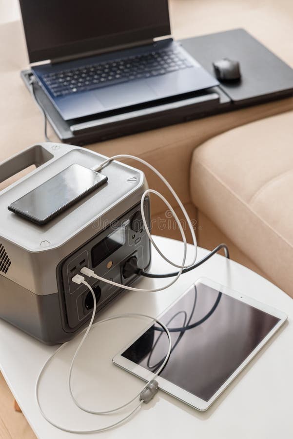 Uninterruptible Power Supply Source. Workspace on Sofa with Laptop ...
