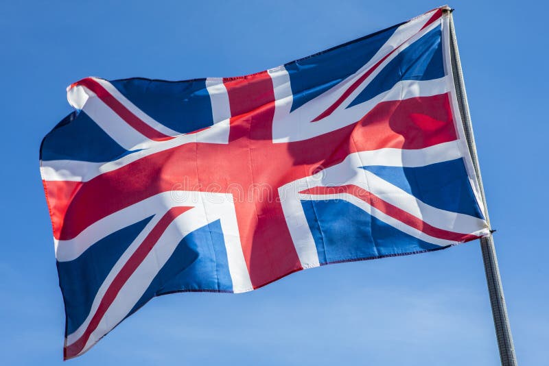 Union Flag Over a Clear Blue Sky Stock Photo - Image of sign, wales ...