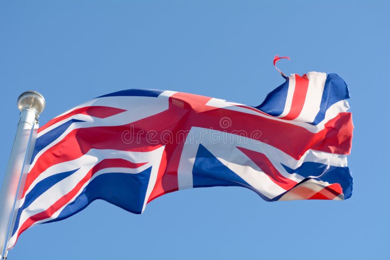 The Union Jack Flag Fluttering Wildly in the Wind on a Sunny Day Stock ...