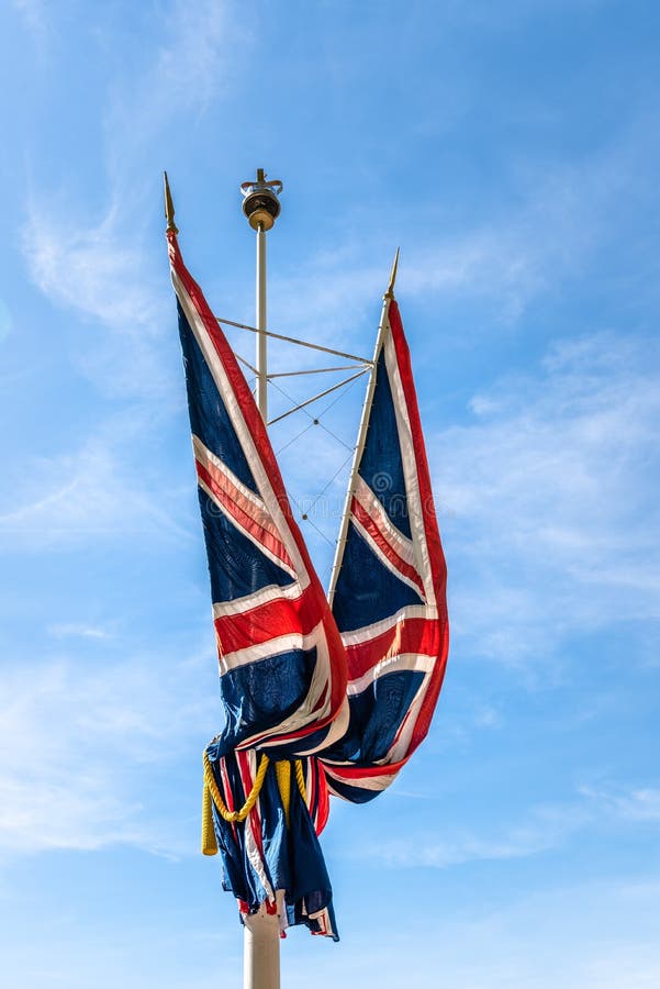 Union Jack Flags Waving Against Blue Sky Stock Photo - Image of freedom ...