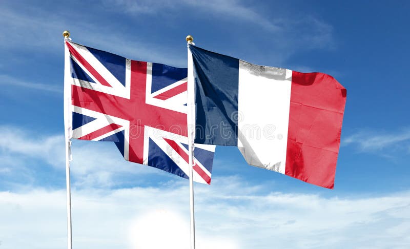 Union Jack and French Flag on Cloudy Sky. Waving in the Sky Stock ...
