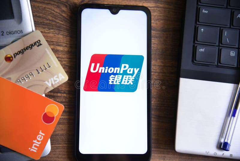 The UnionPay Logo is Displayed on a Smartphone on a Table with Cards ...