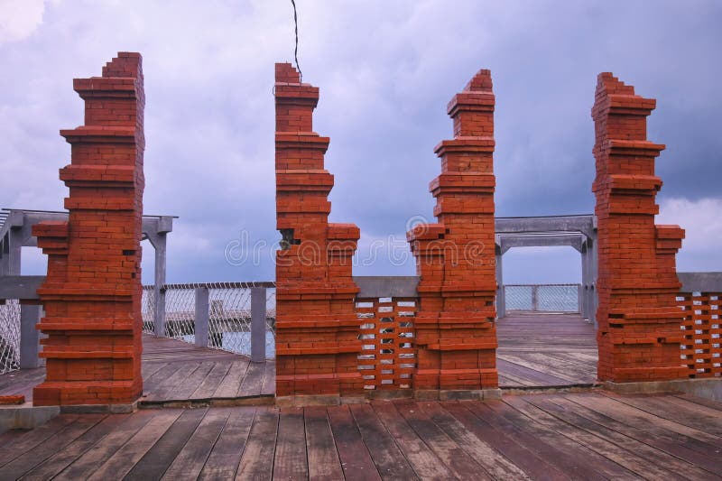 The Unique Architectural Beauty of Red Brick Pillars in a Tranquil ...