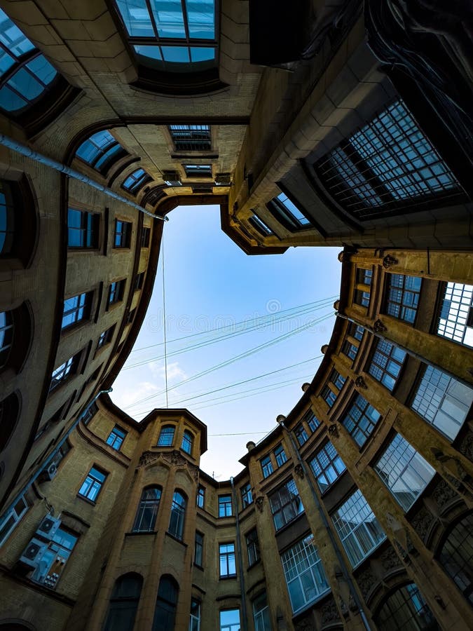 Unique Architectural Perspective of a Historic Courtyard with Clear Sky ...