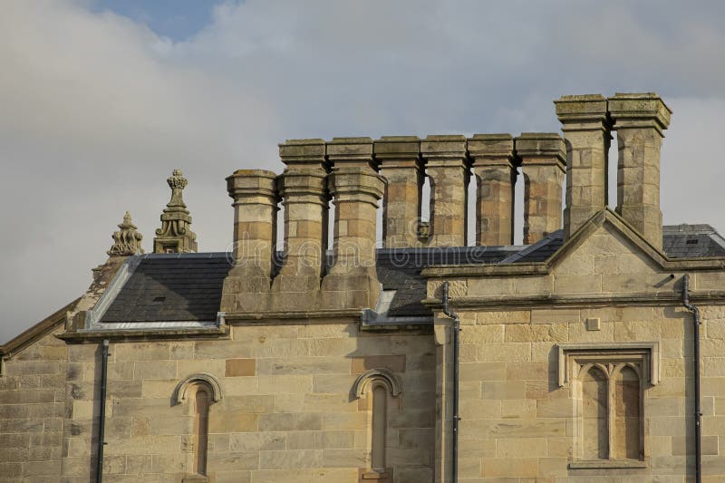 Unique Chimneys of a Pale Coloured Stone Building Stock Image - Image ...