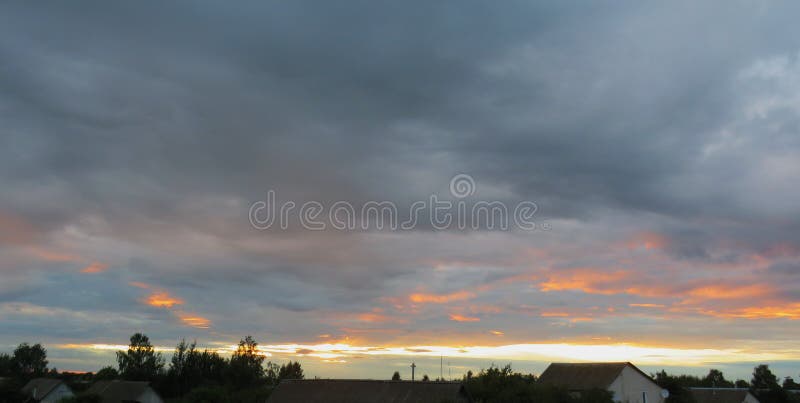 Unique Clouds, Illuminated by the Rays of the Setting Sun. Stock Photo ...