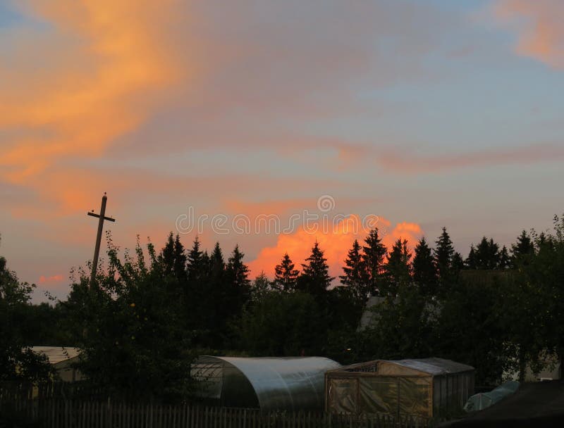 Unique Clouds, Illuminated by the Rays of the Setting Sun. Stock Photo ...
