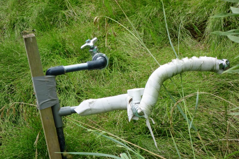A Unique Faucet of Water Services that is Wild in the Grass Stock Photo ...