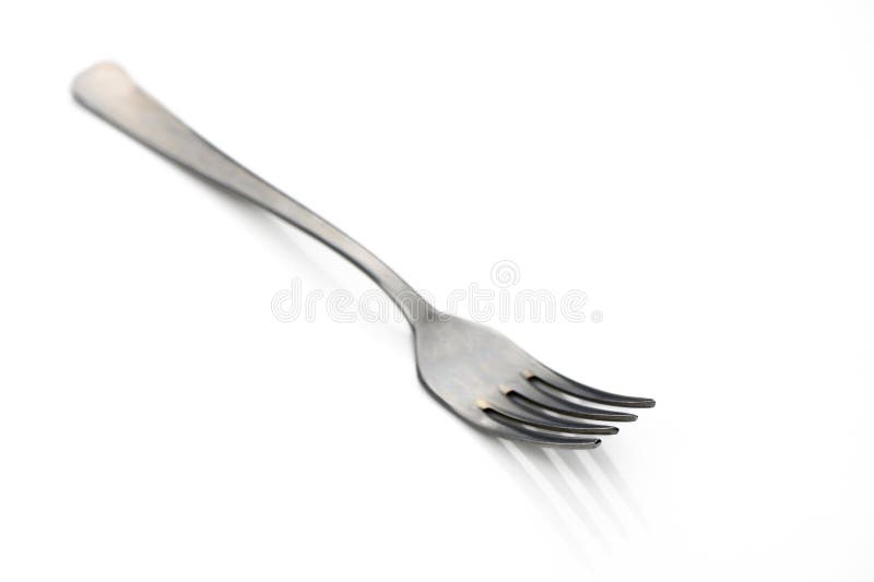 Unique Fork Rests on a Clean White Surface, Highlighting Its Sleek ...