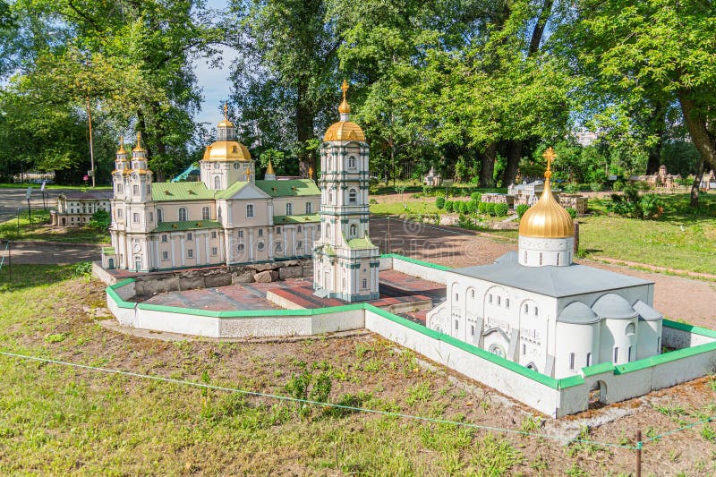 A Unique Image Showcasing Three Miniature Traditional Buildings ...