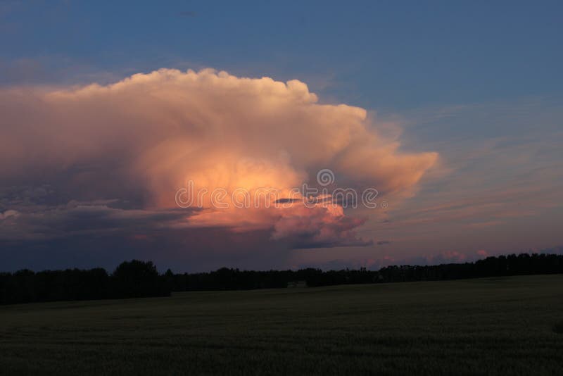 Storm cloud over fields stock image. Image of stormy - 130425569