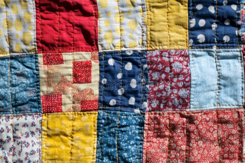 A Unique Patchwork Quilt Fabric Texture Background with Vibrant, Mismatched Patterns in Red ...