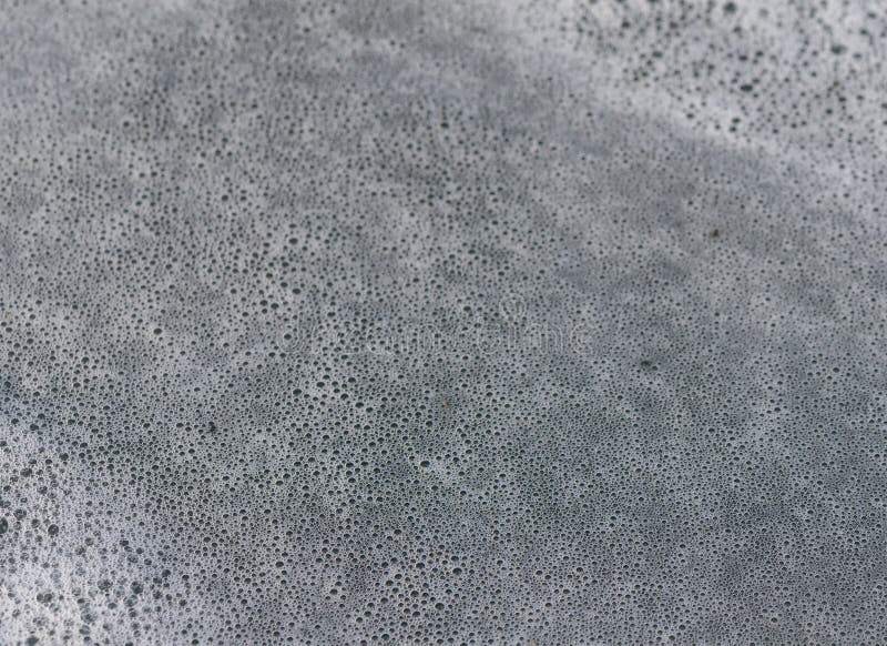 Unique Patterns of Foam on a Rocky Shoreline Create a Mesmerizing ...