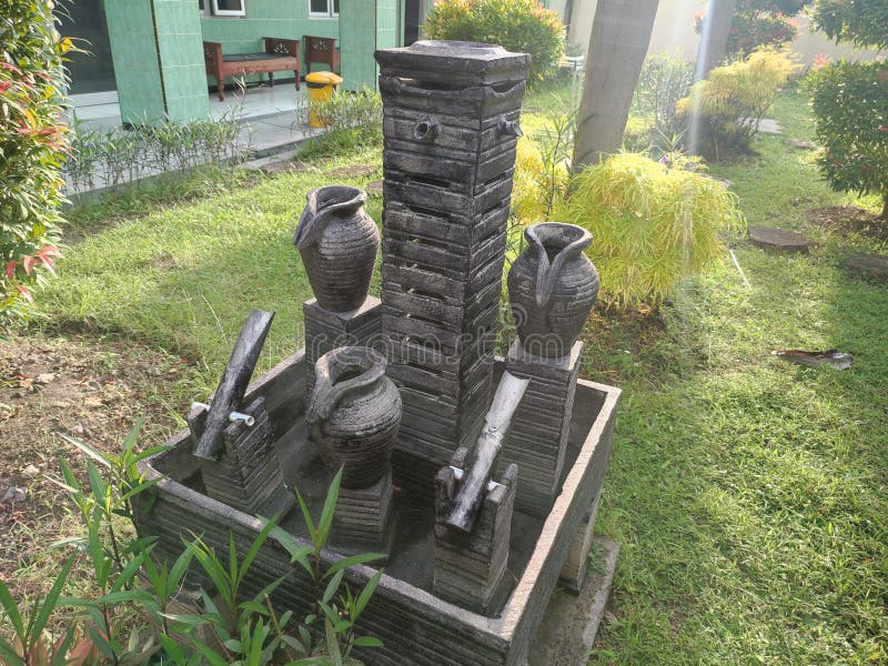 The Unique Relief Shape of the Water Shower Container in the Garden ...
