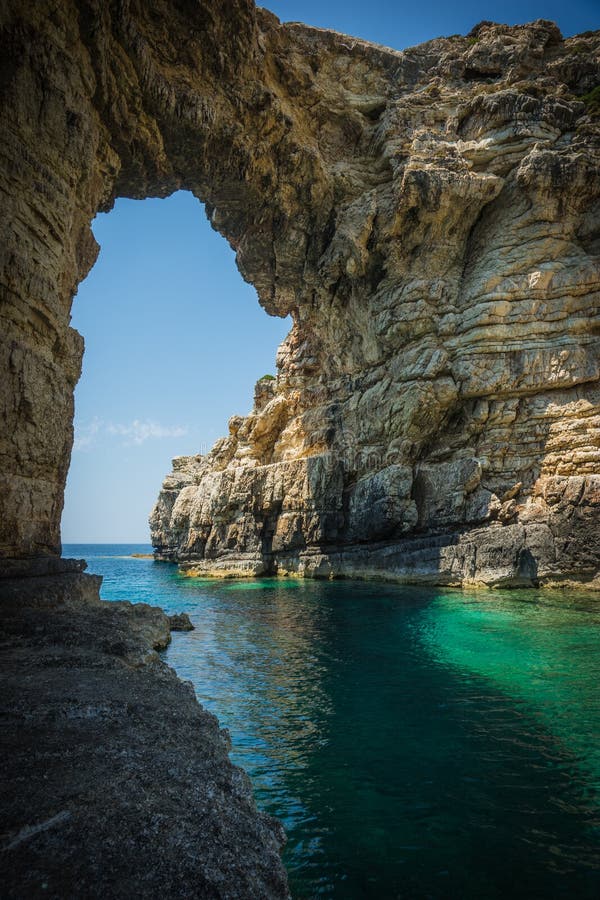 Unique and Scenic Arch in the Cliffs, Paxi, Greece Stock Photo - Image ...