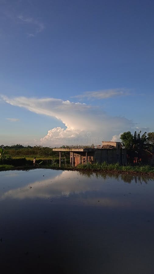 A Unique Shape of Clouds and Reflection Stock Photo - Image of water ...