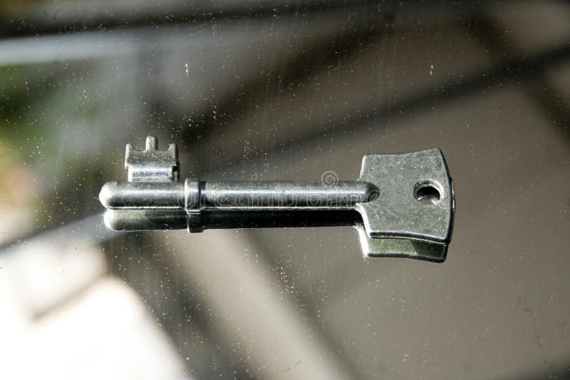 Unique Silver House Key on a Glass Table with Reflection Stock Image ...