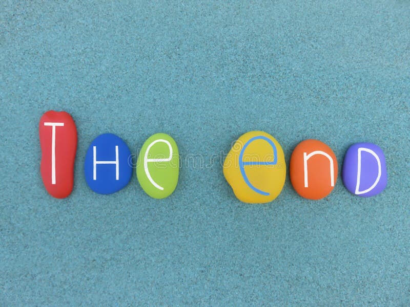 The End, Creative Text Composed with Colored Stone Letters Over Green ...